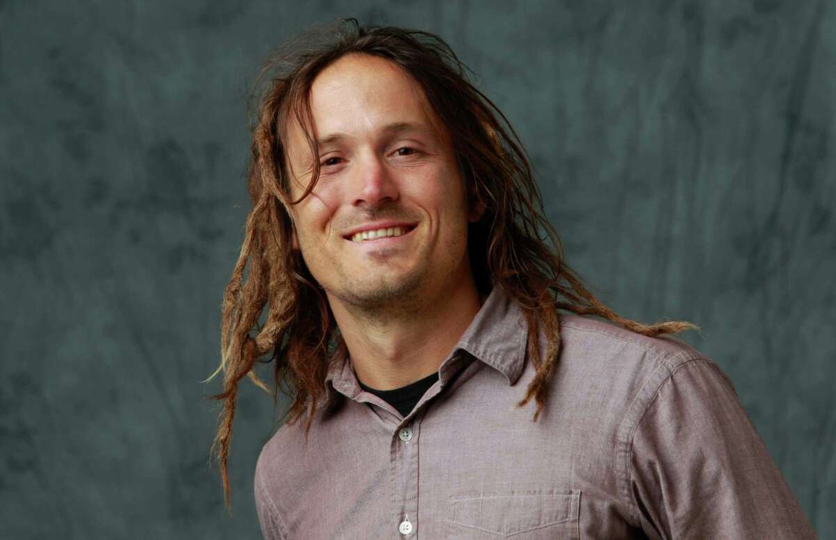 Folk-blues musician Robert Kuhn's travels have brought color and depth ...