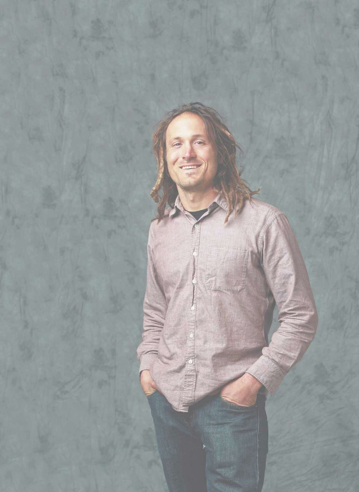 Folk-blues musician Robert Kuhn's travels have brought color and depth ...