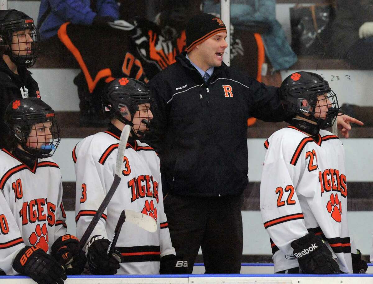 Ridgefield holds off New Canaan in hockey battle