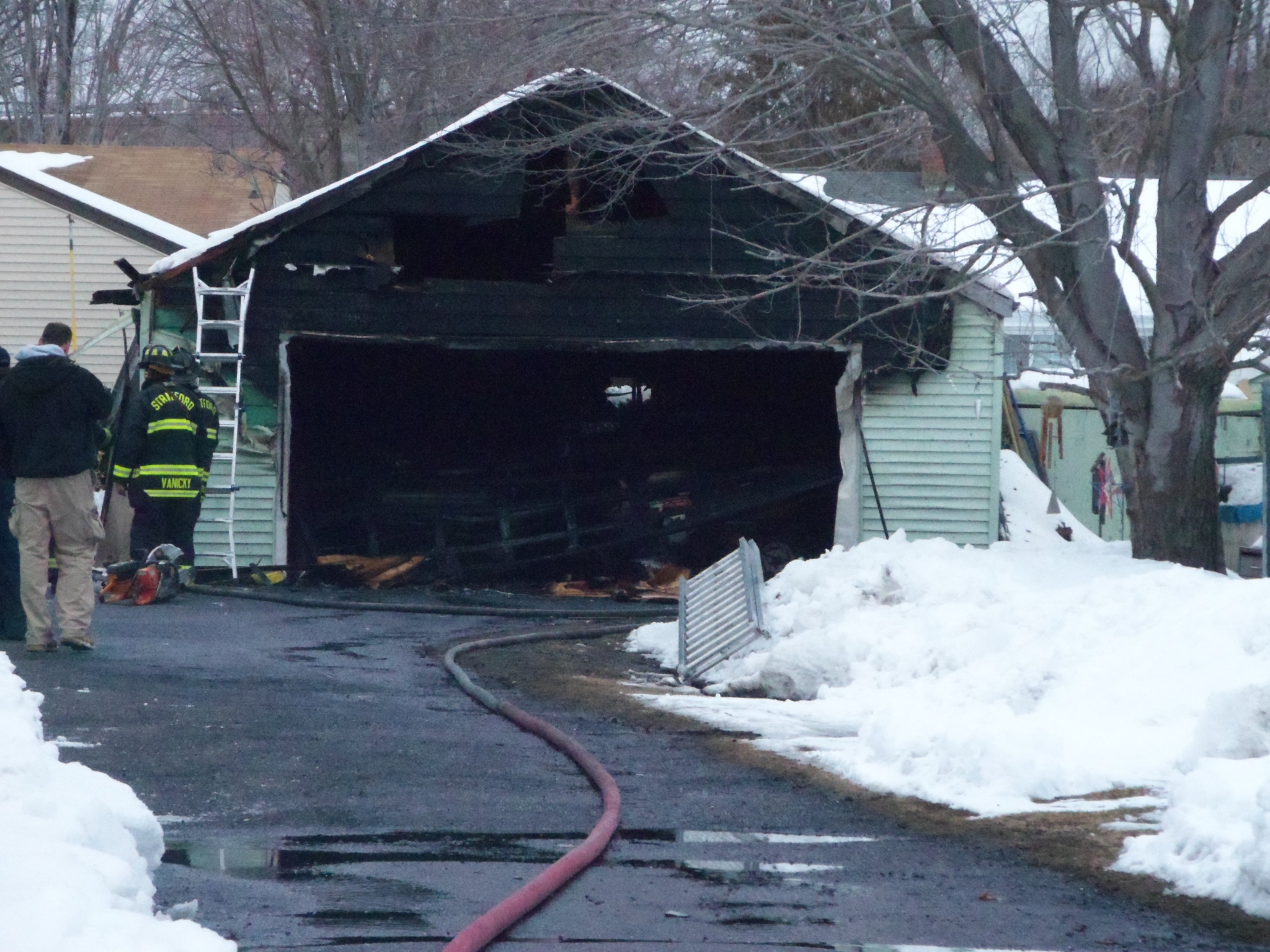 Garage, two vehicles badly burned