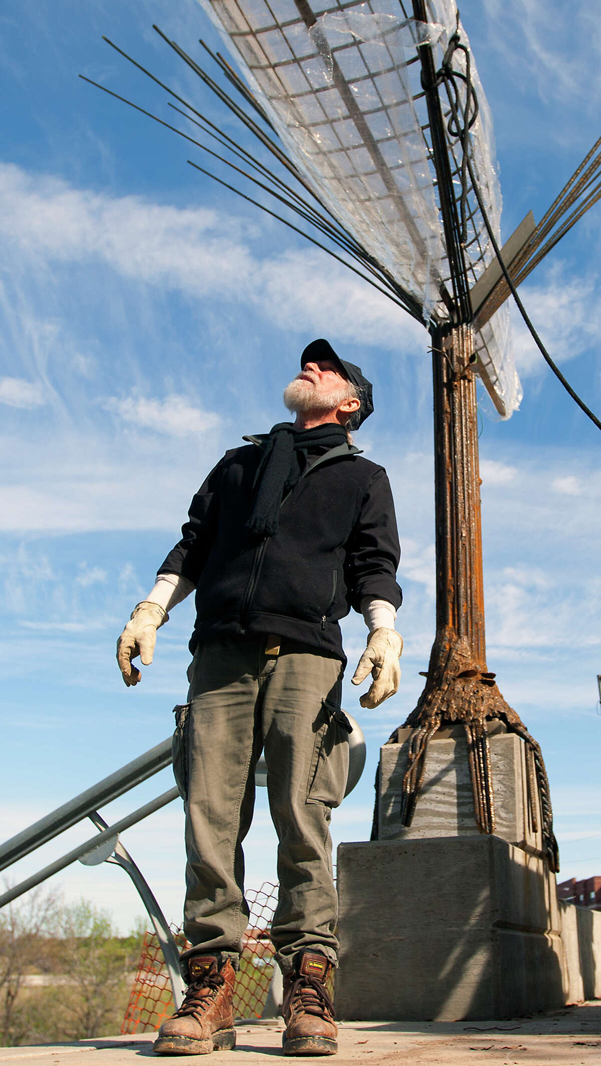 Stainless steel canoe appears in the trees along Buffalo Bayou