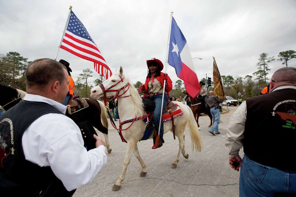 Cowboys trek through downtown to Rodeo kickoff