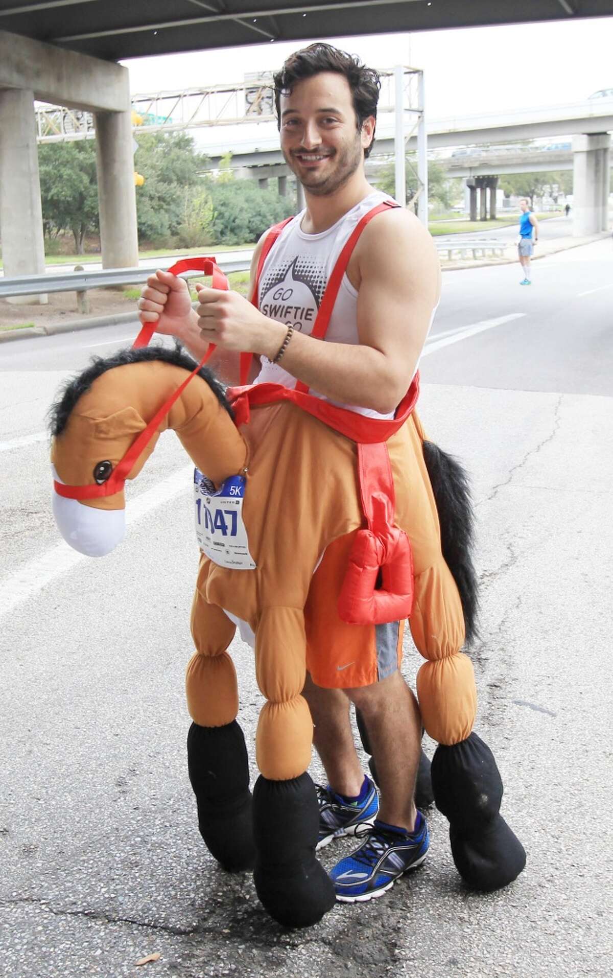 Cowboys trek through downtown to Rodeo kickoff