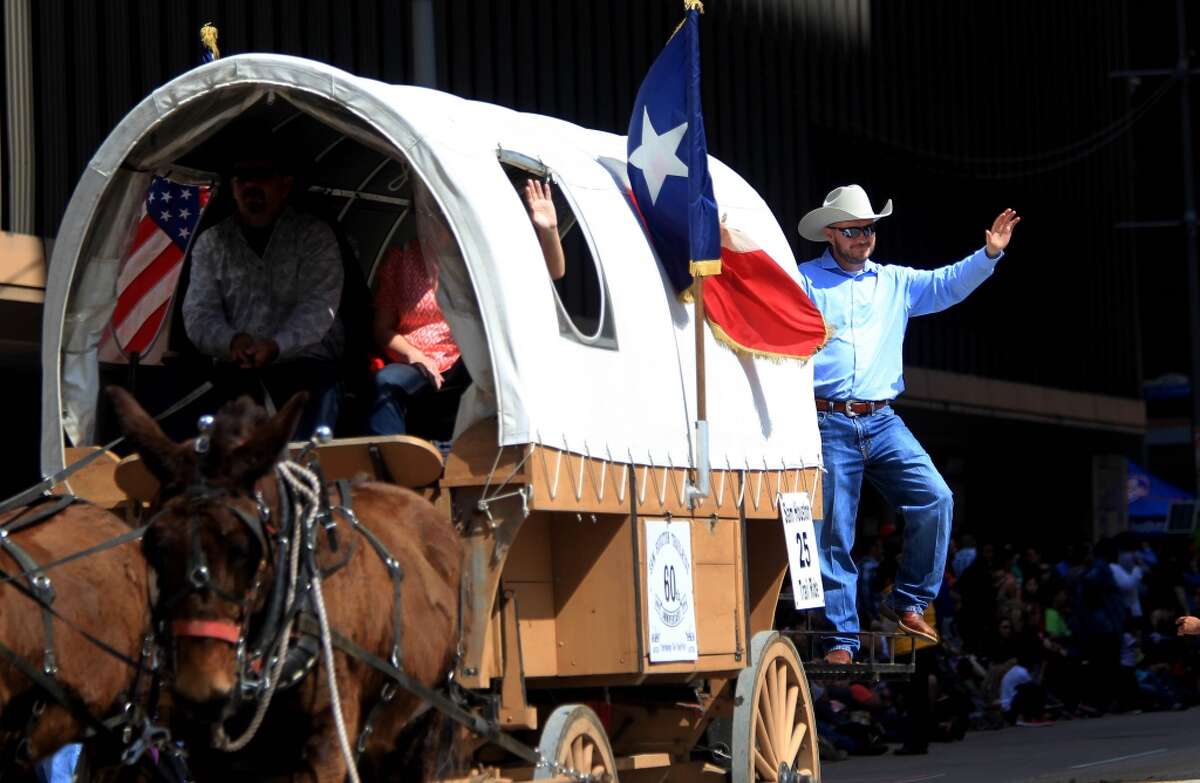 Cowboys trek through downtown to Rodeo kickoff