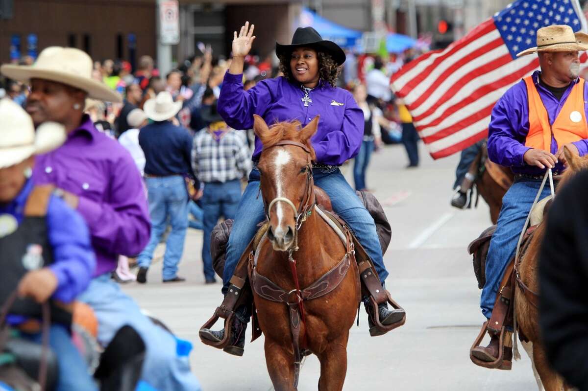 Cowboys trek through downtown to Rodeo kickoff
