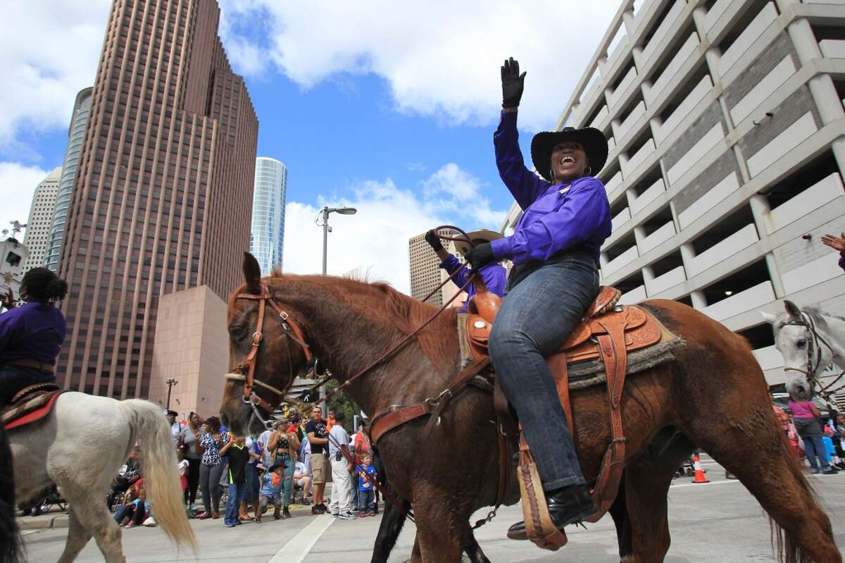 Cowboys trek through downtown to Rodeo kickoff