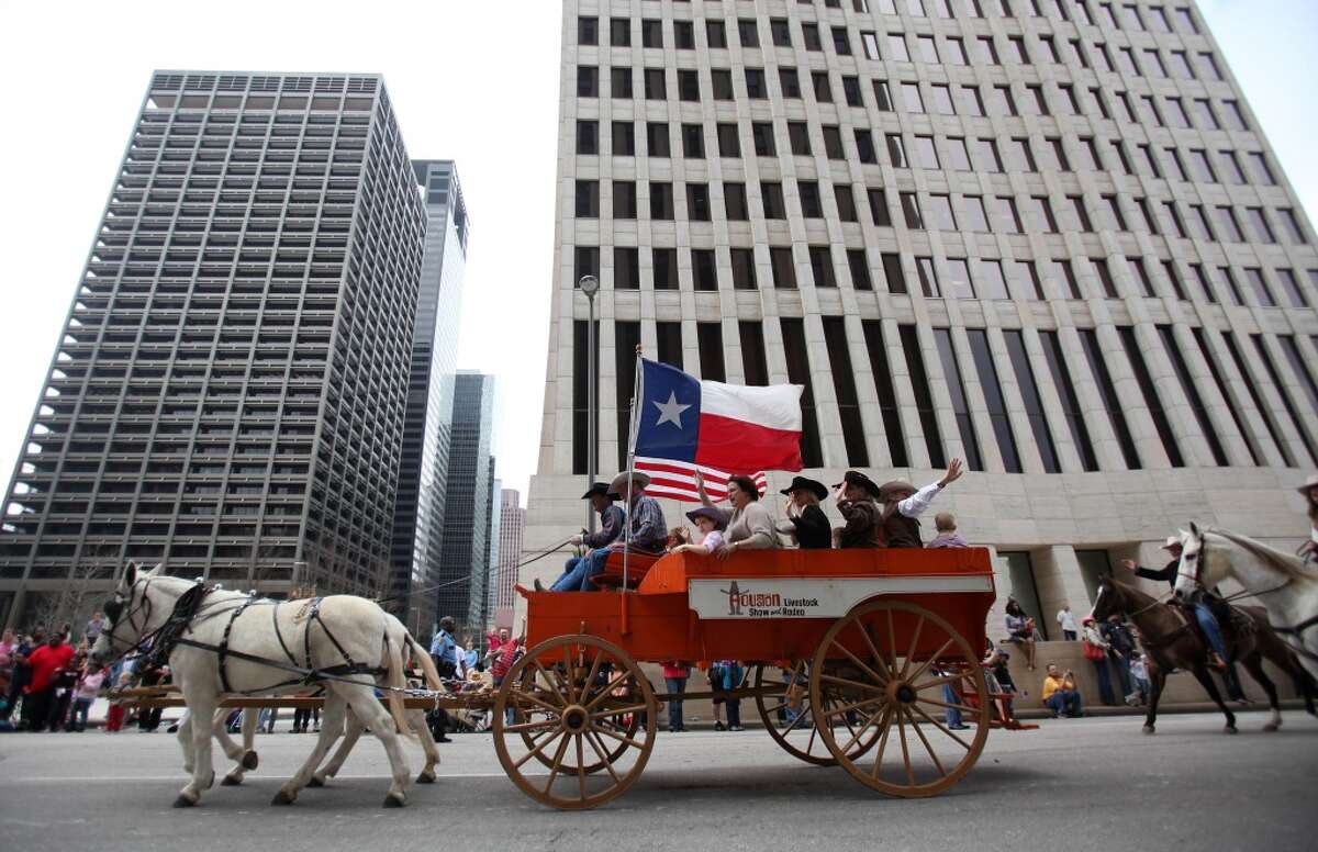 Cowboys trek through downtown to Rodeo kickoff