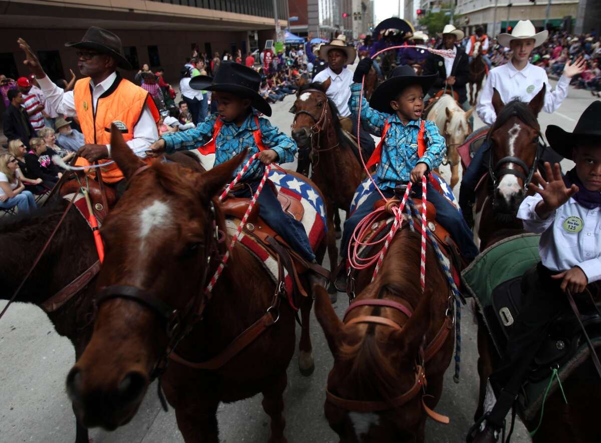 Cowboys trek through downtown to Rodeo kickoff