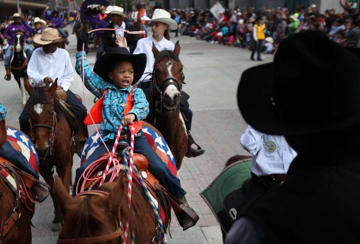Cowboys trek through downtown to Rodeo kickoff