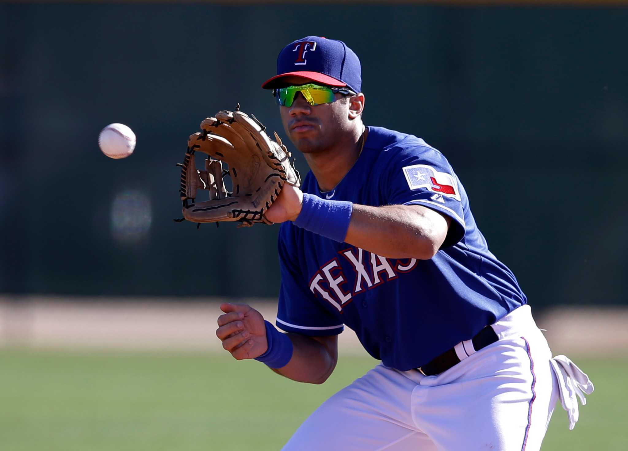 Wilson does glove work during day with Rangers