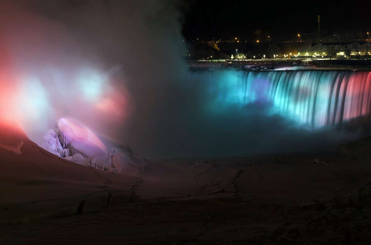 Niagara Falls freezes over, gets bathed in neon