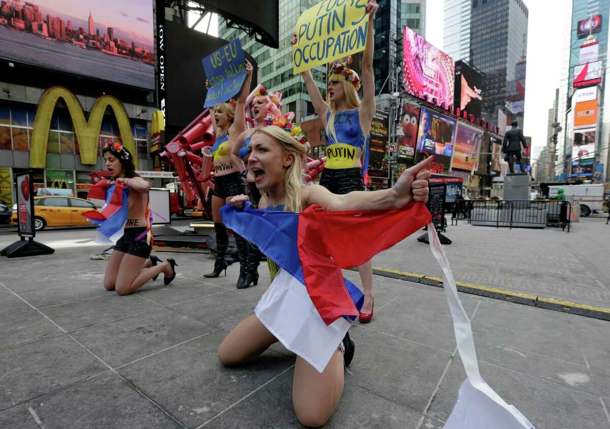 World news photos: Femen in U.S., dramatic horse rescue and more