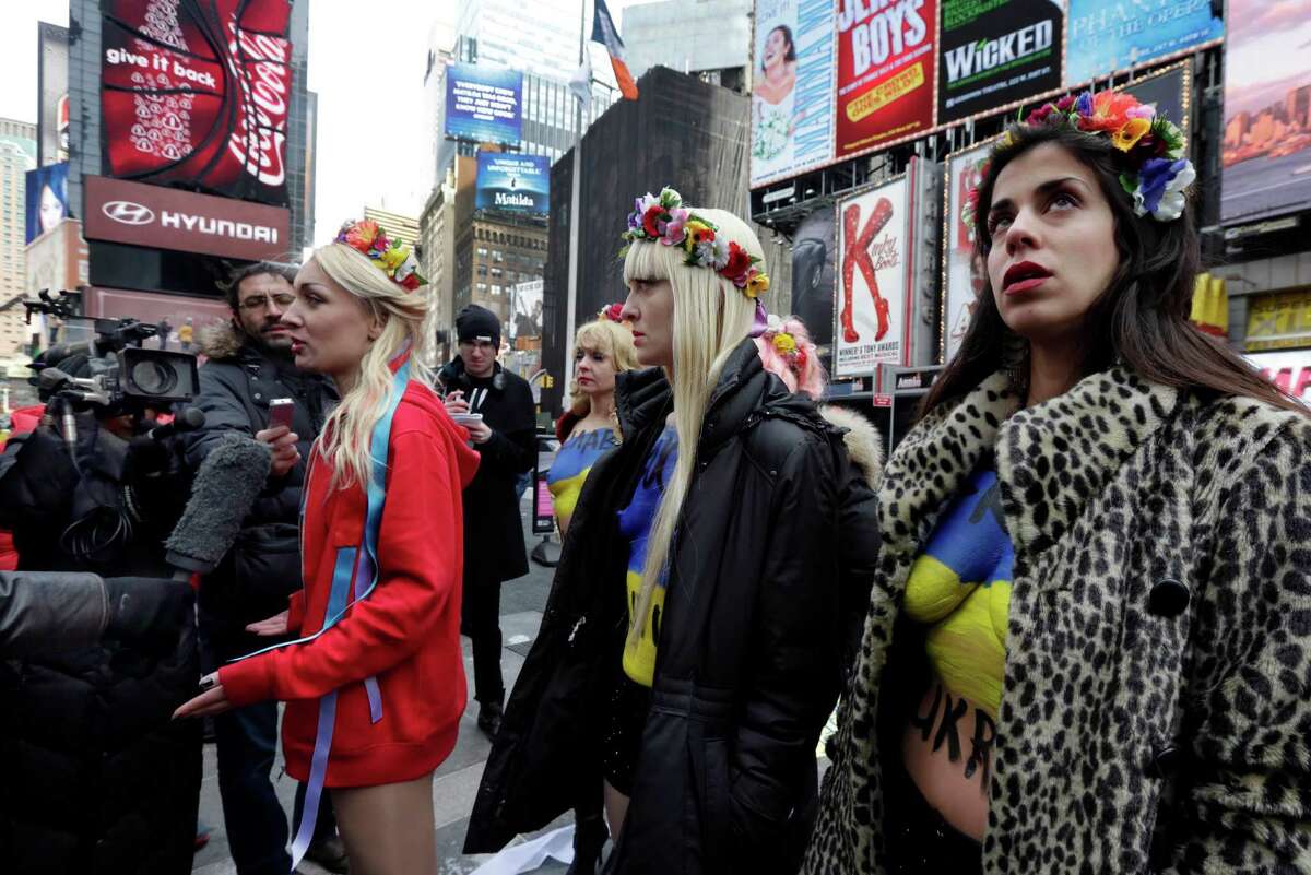 World news photos: Femen in U.S., dramatic horse rescue and more