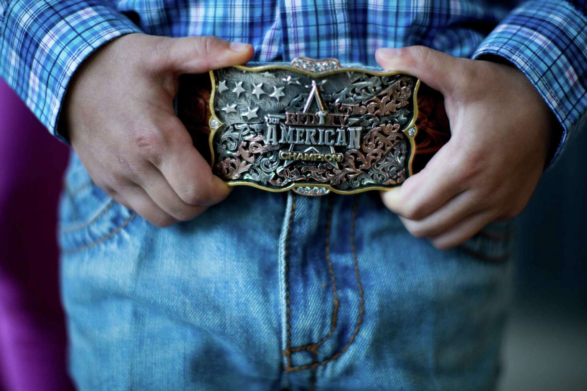 Rodeo competitors show their pride with trophy buckles