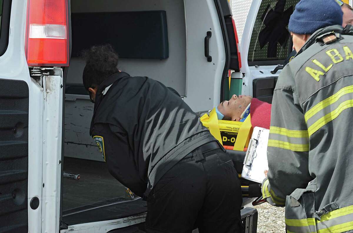 Car hits bridge; suspect jumps