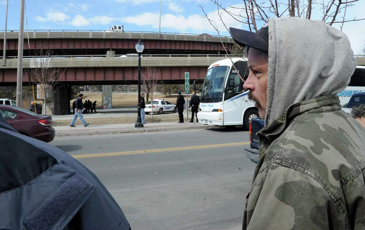 Car hits bridge; suspect jumps