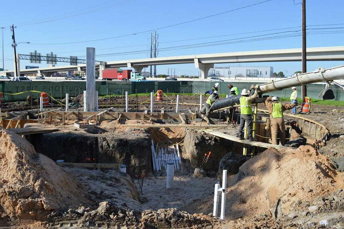 6-story cross and water wall going up at major Houston highway intersection