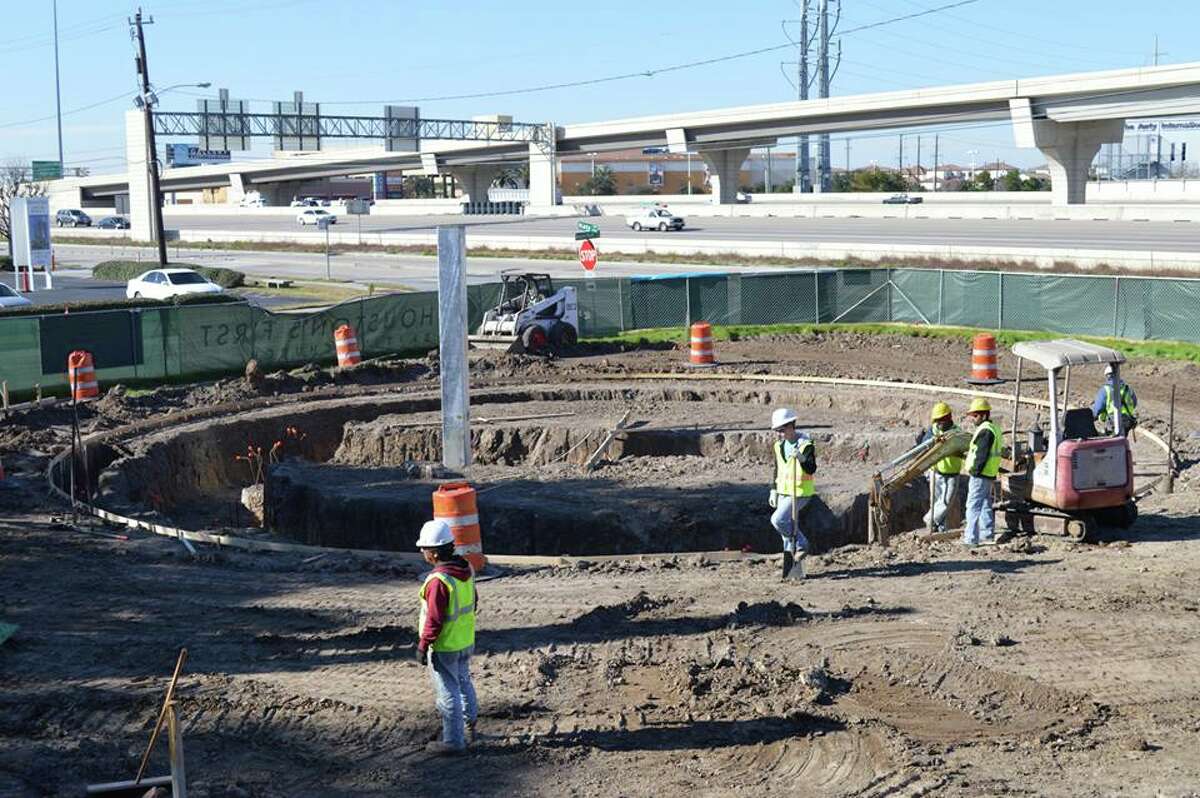 6-story cross and water wall going up at major Houston highway intersection