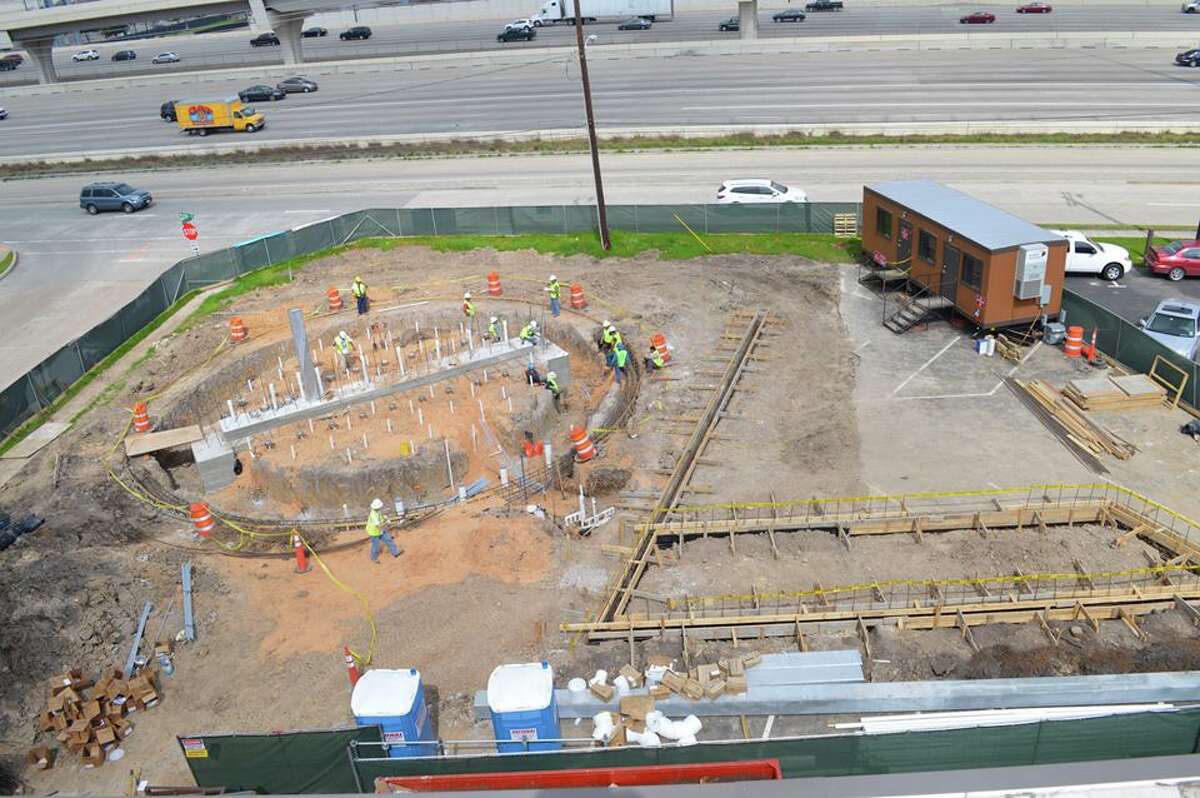 6-story cross and water wall going up at major Houston highway intersection