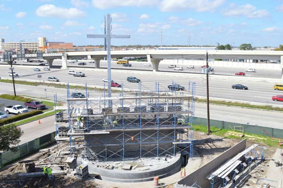 6-story cross and water wall going up at major Houston highway intersection