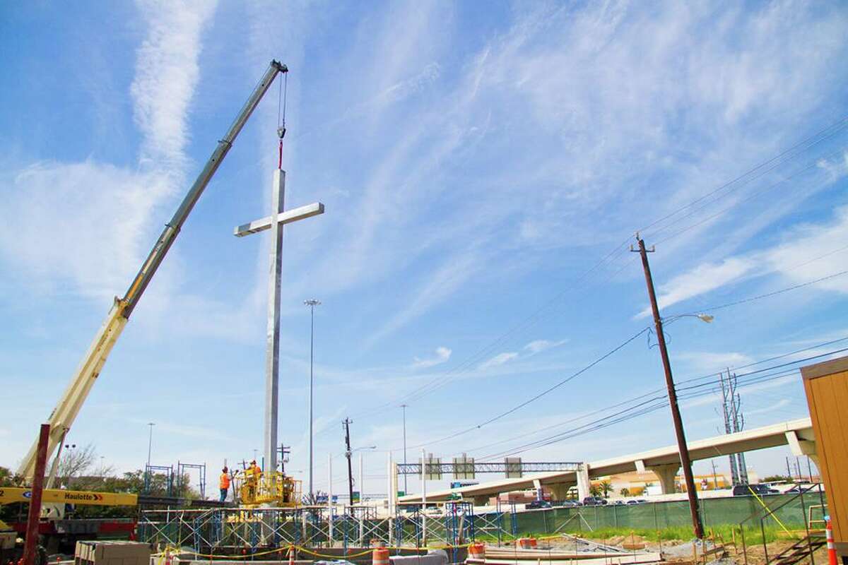 6-story cross and water wall going up at major Houston highway intersection