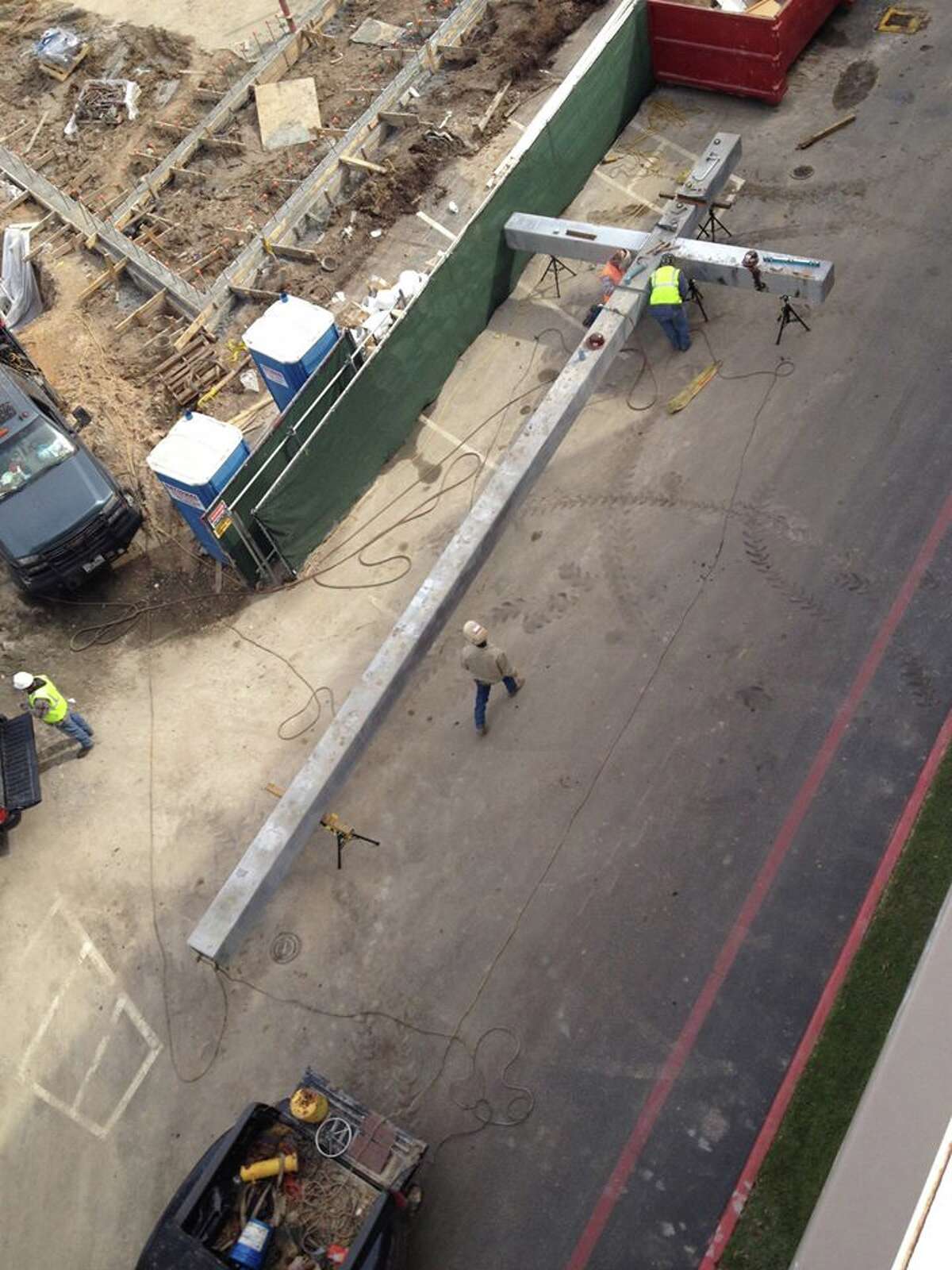6-story cross and water wall going up at major Houston highway intersection
