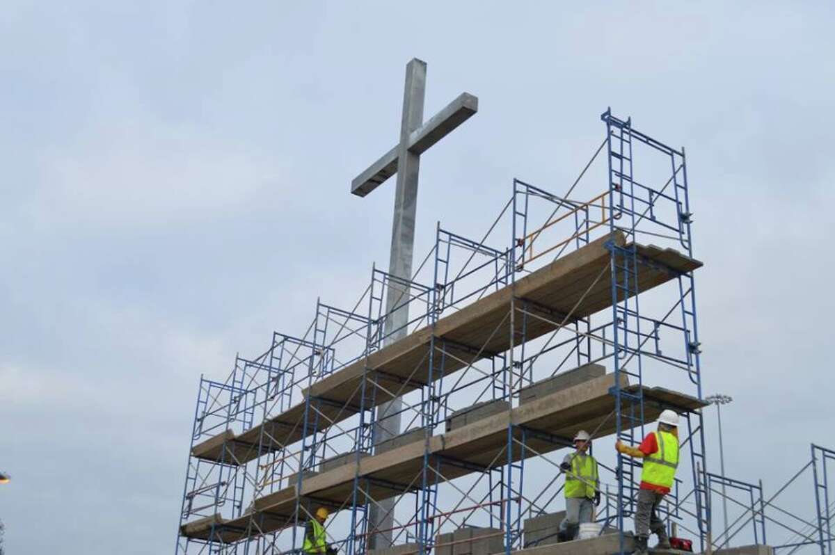 6-story cross and water wall going up at major Houston highway intersection