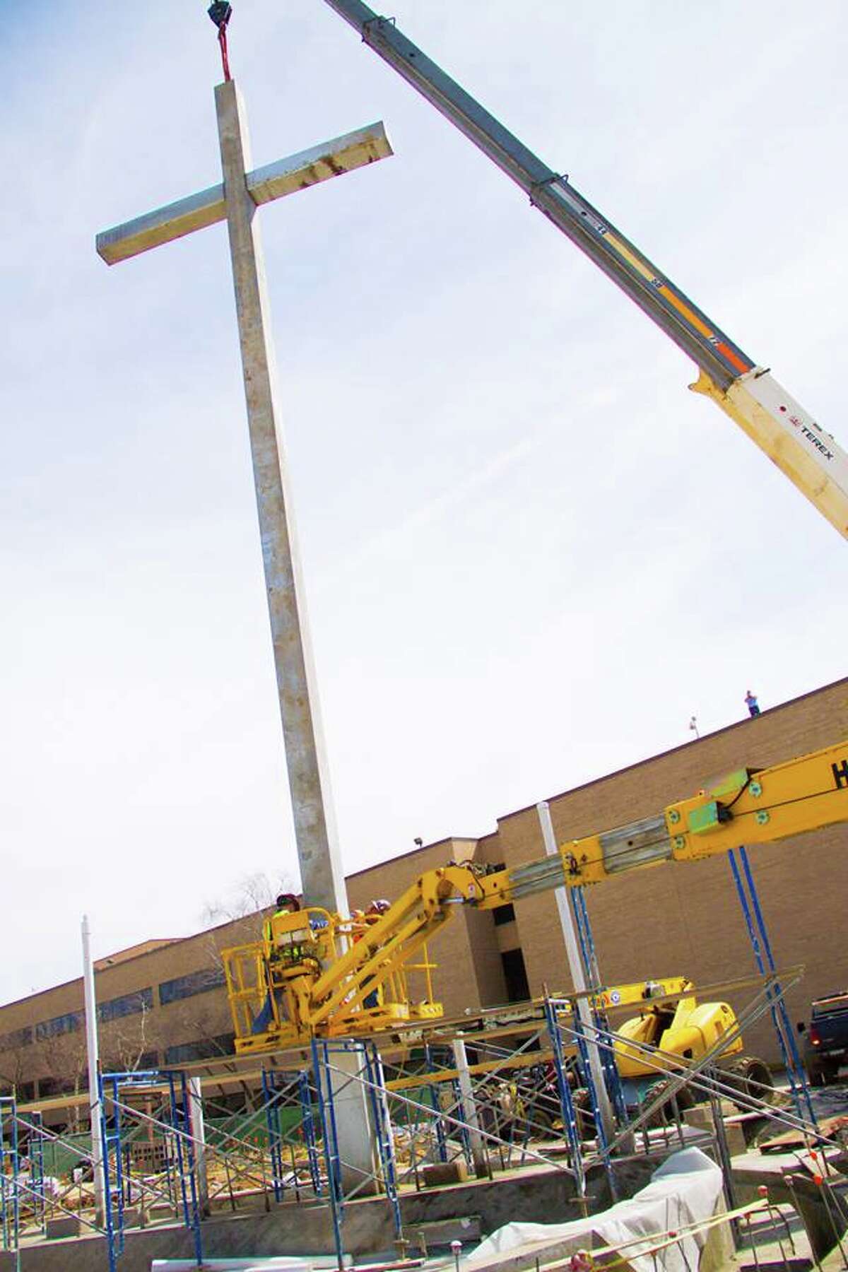 6-story cross and water wall going up at major Houston highway intersection