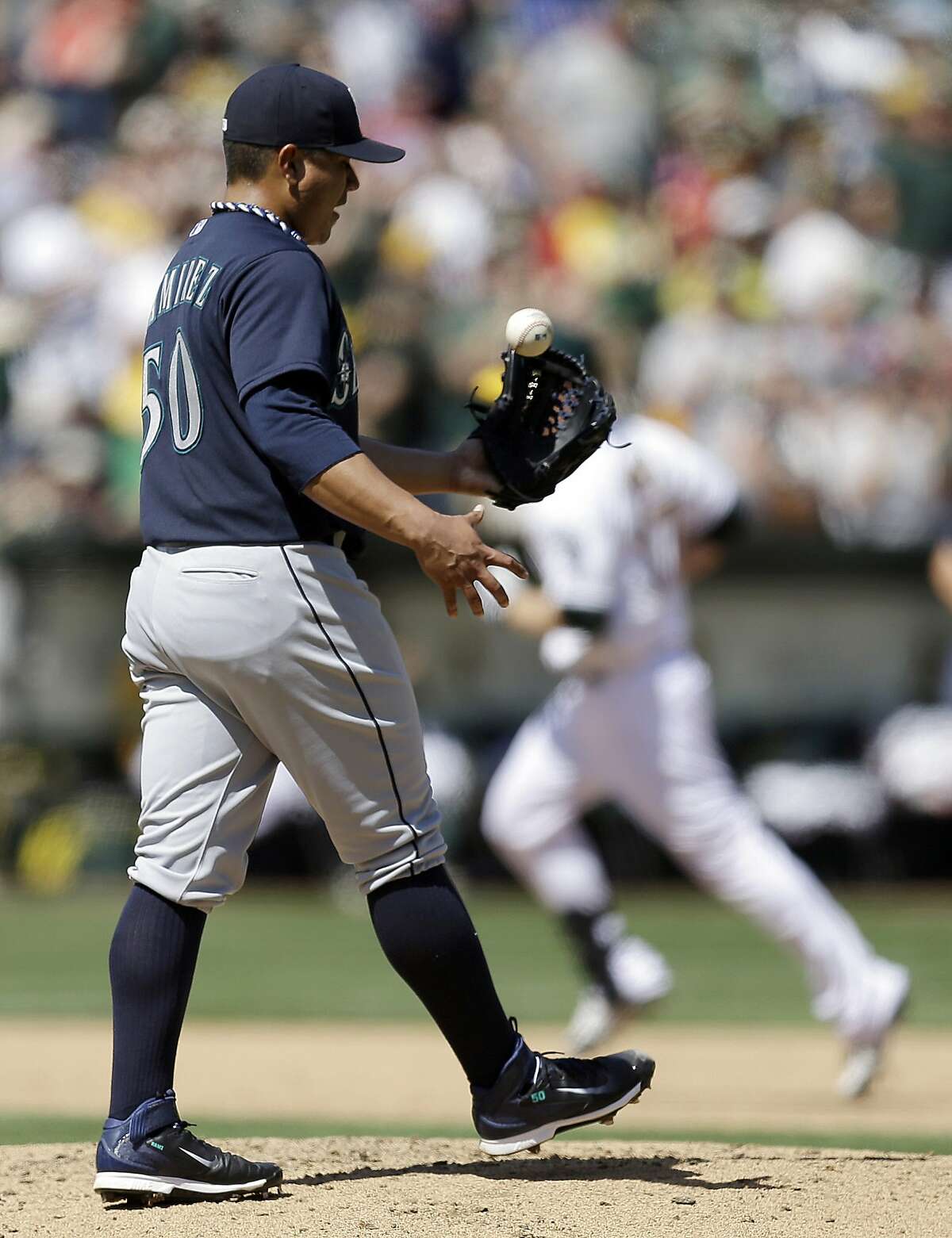 A's rally to beat Seattle 6-3