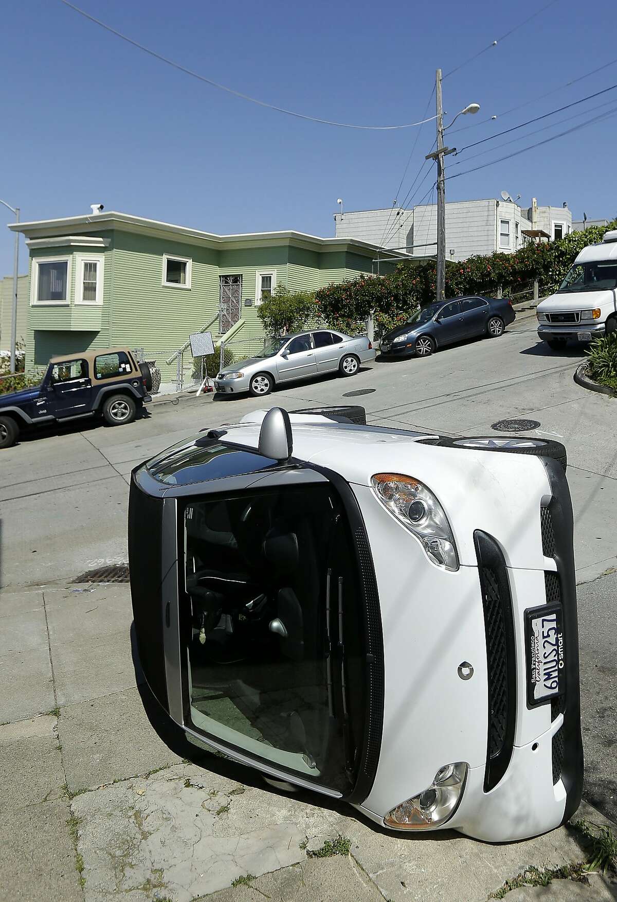 4 Smart microcars tipped over around Bernal Heights