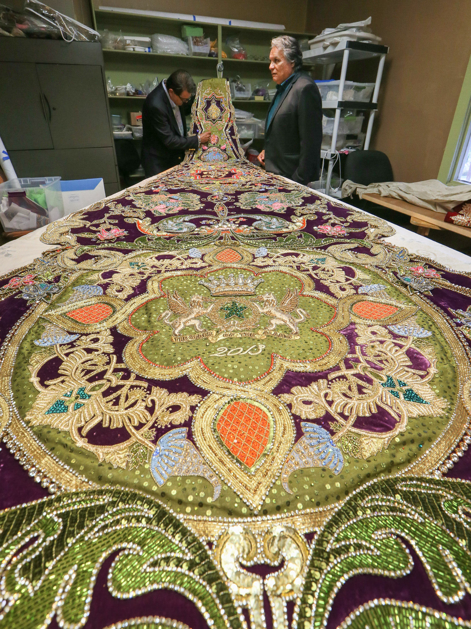 Master embroiderer stitches old world work in Fiesta gowns