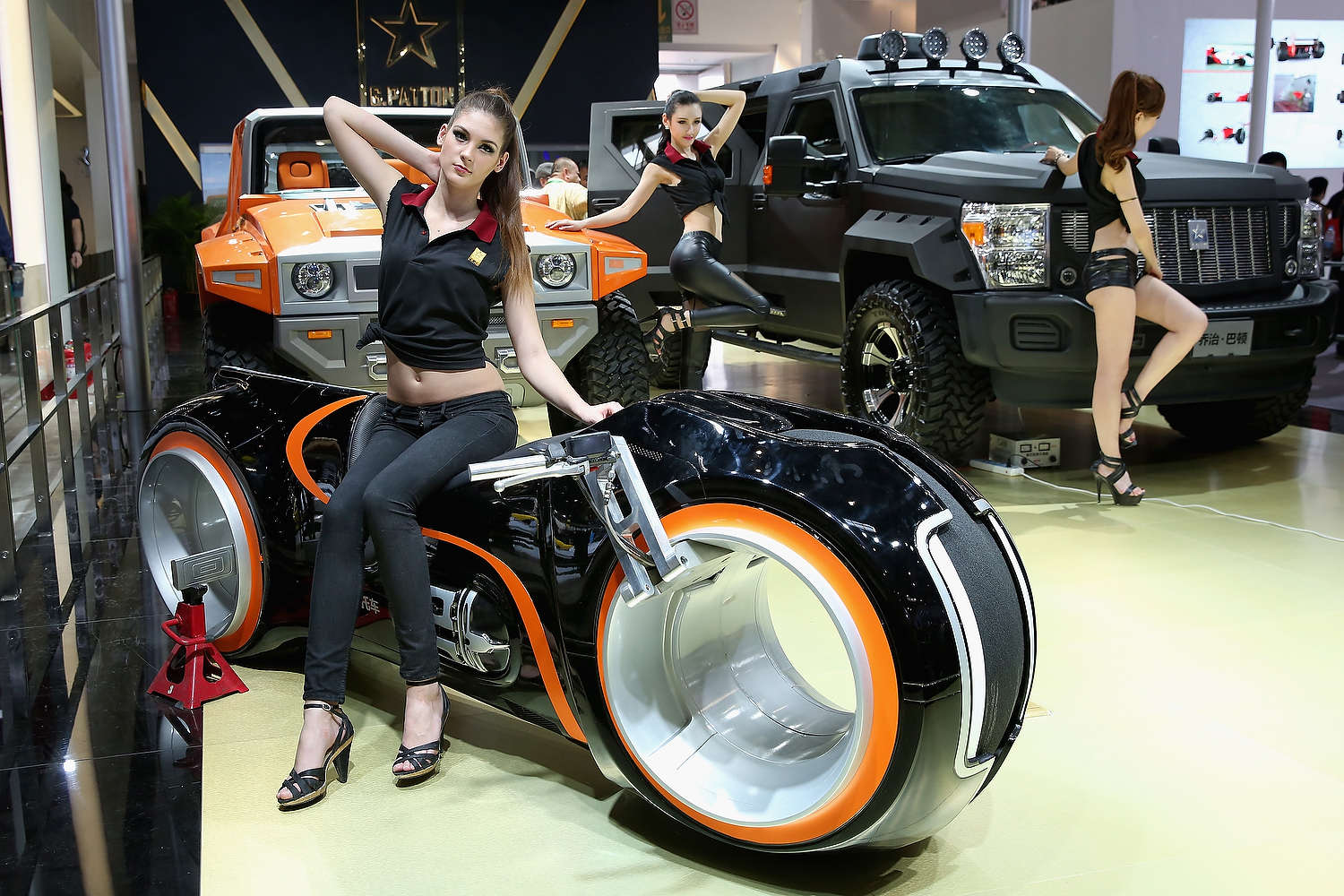 Models upstage autos at the Beijing auto show