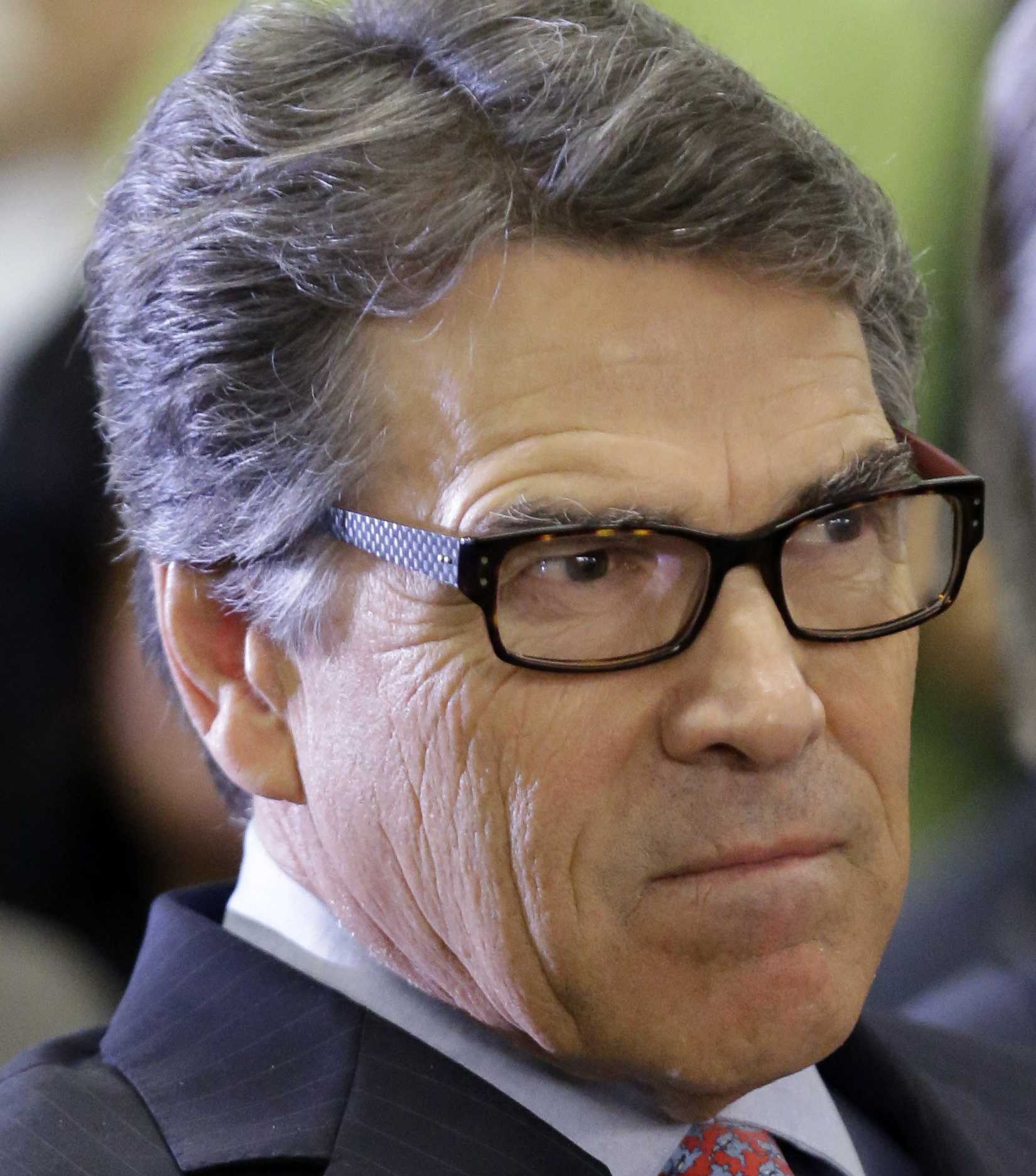 Perry aides appear before grand jury looking into whether he overstepped