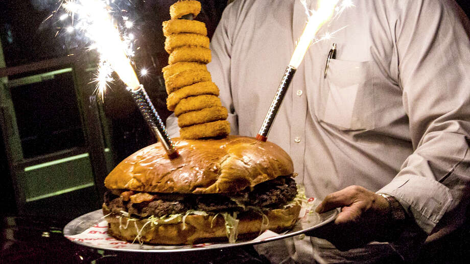 Arian Foster and 5-pound burger star at Woodlands bowling alley opening ...