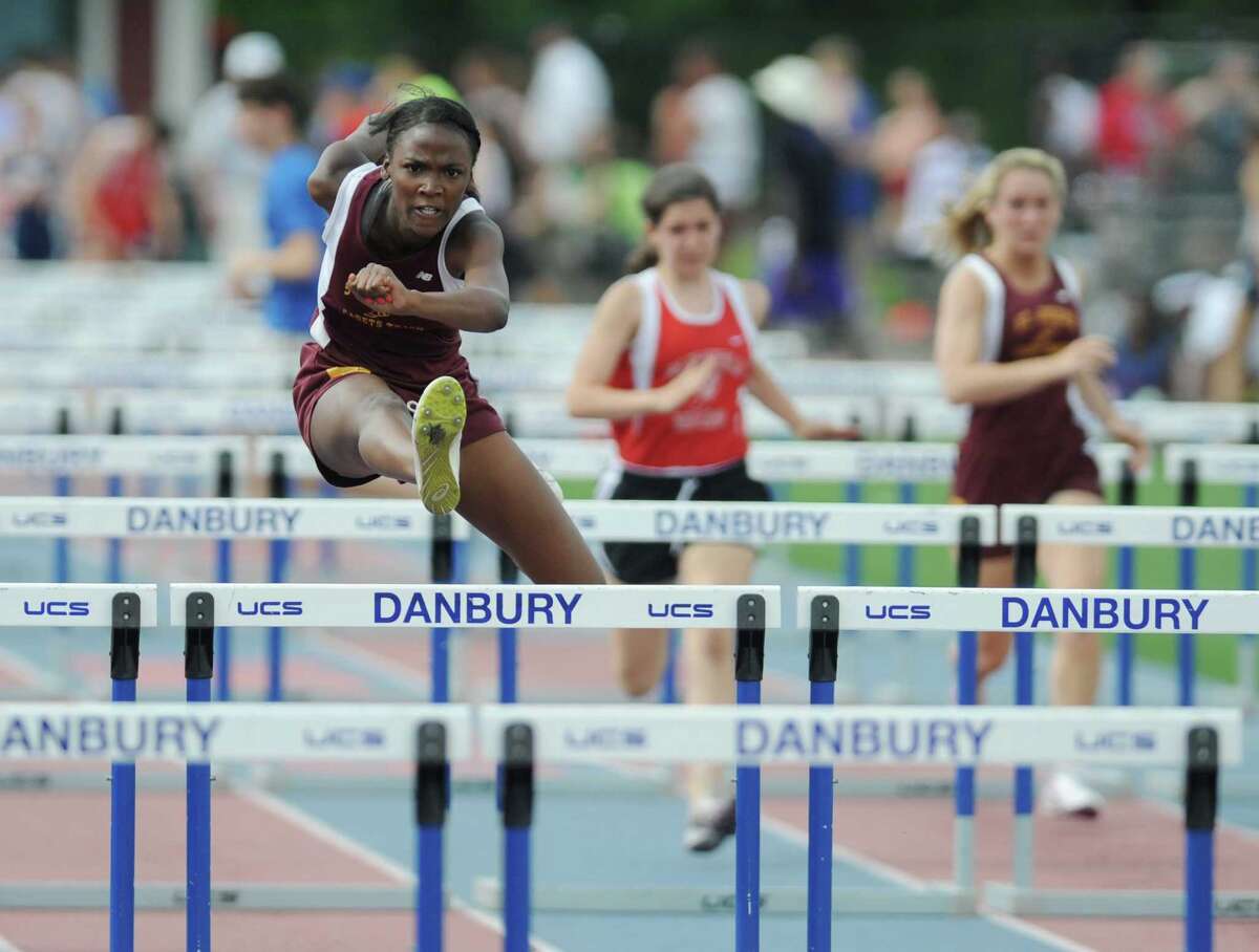 Danbury boys, Darien girls currently in first place at FCIAC track and ...