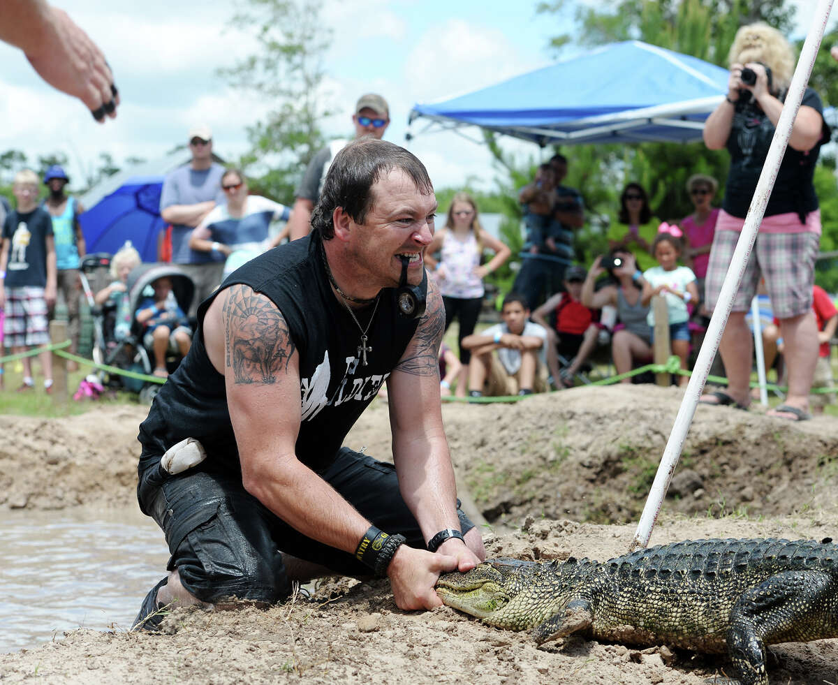 Photos: Gator Country nabs 400 pound monster in Groves