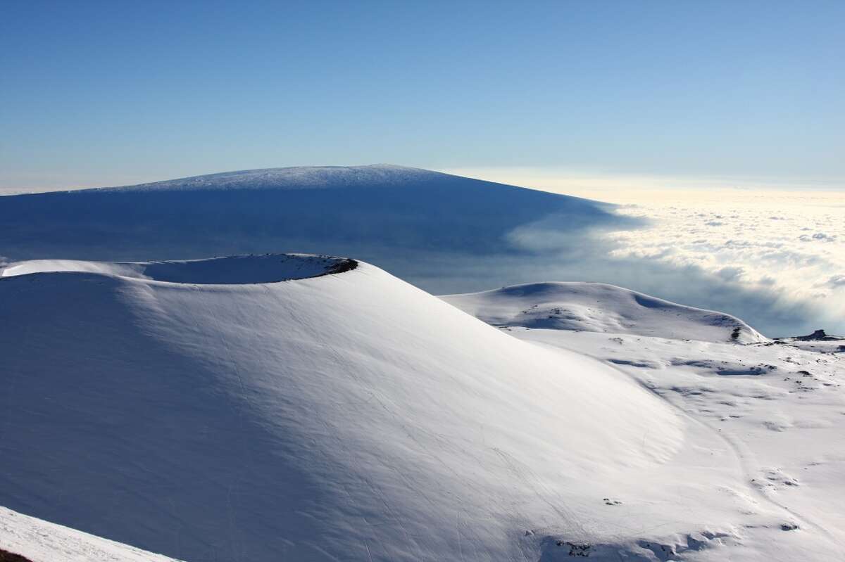 Snow blankets Mauna Kea and Mauna Loa on the Big Island of Hawaii