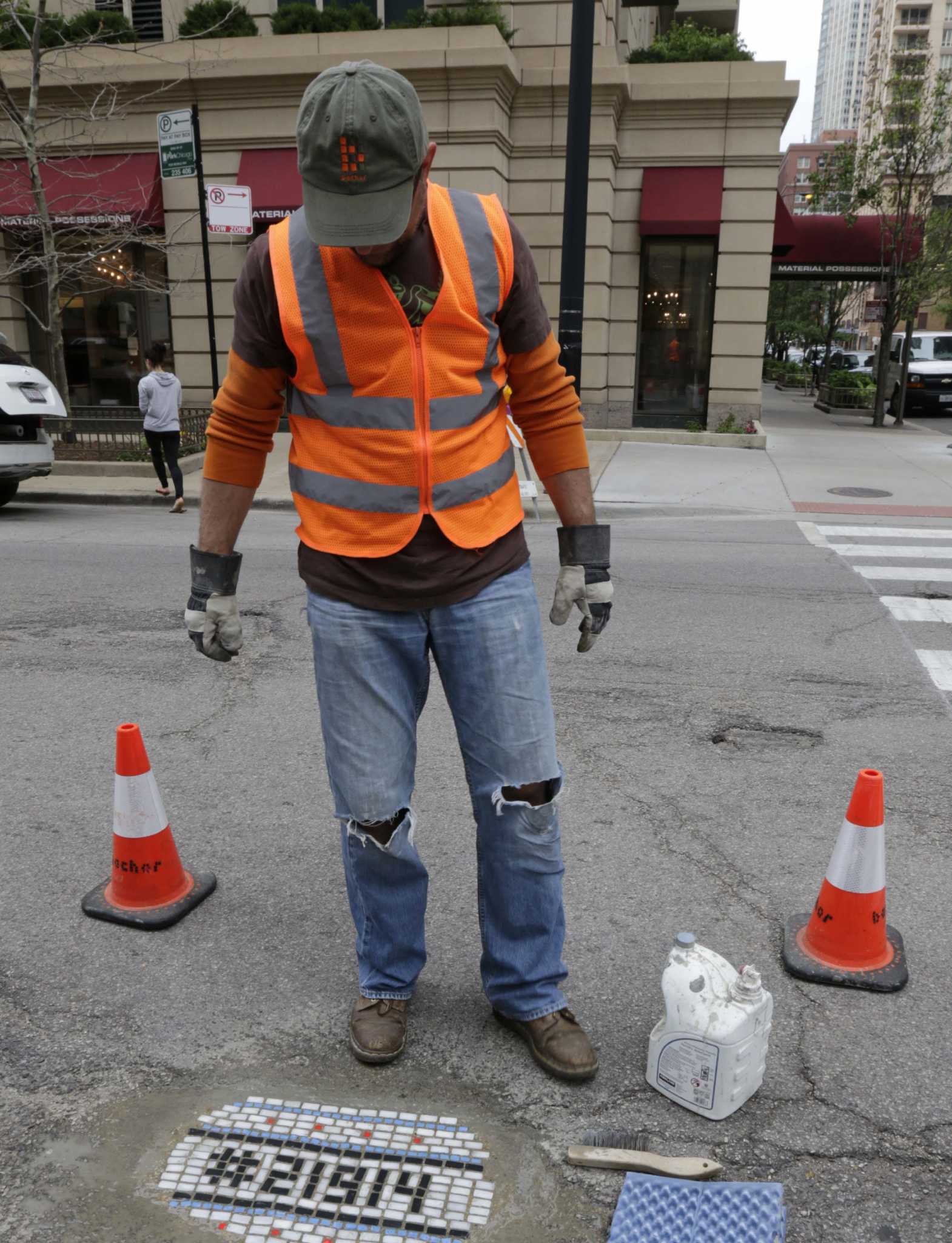Chicago man filling potholes artfully