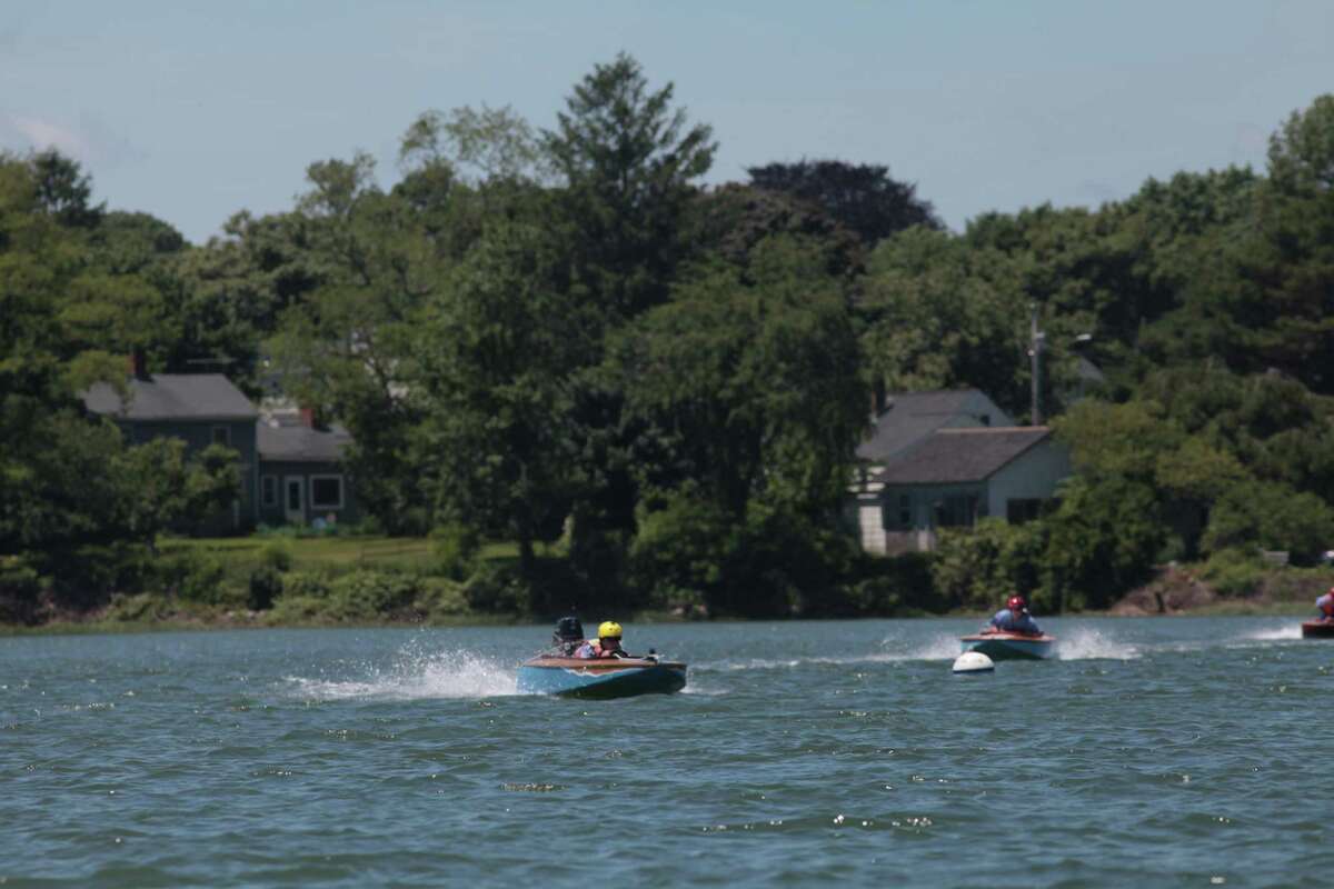Aquaculture students race boats they made