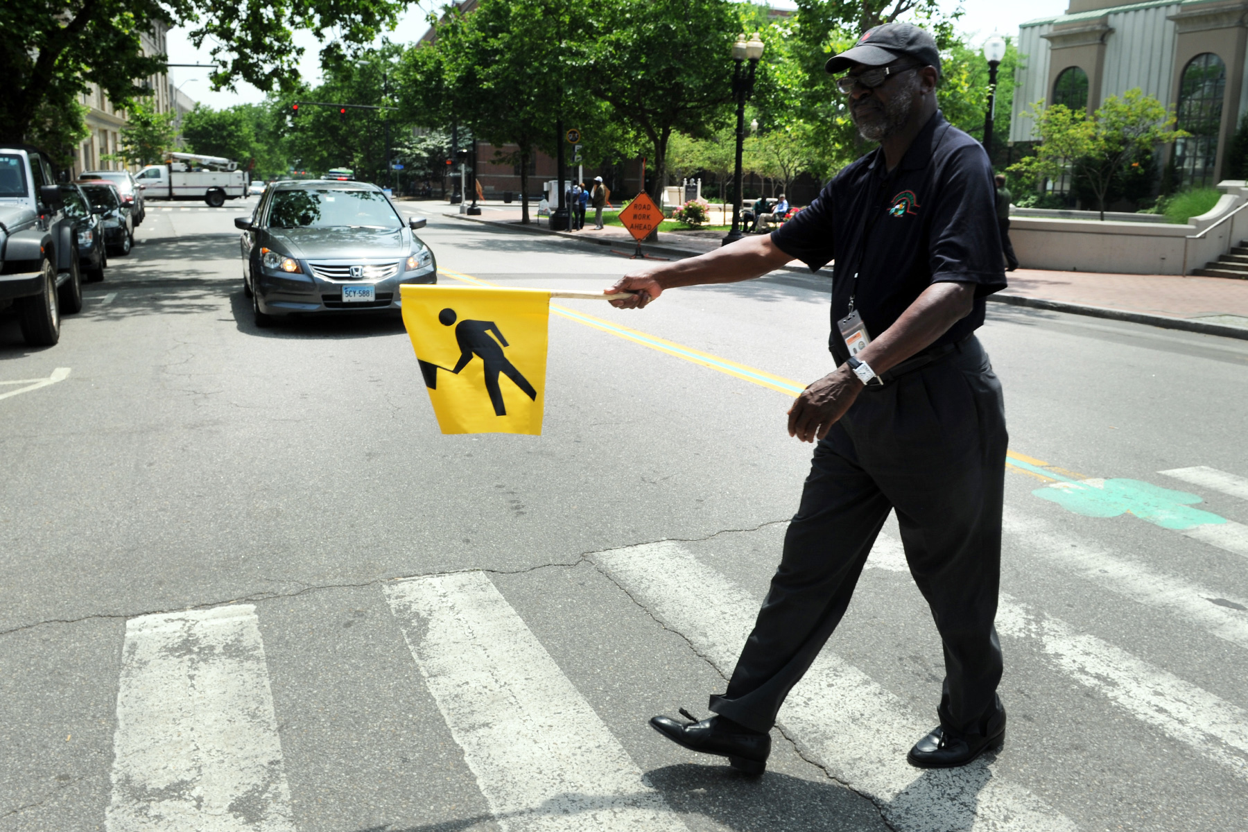 Wave flag to cross street -- then run