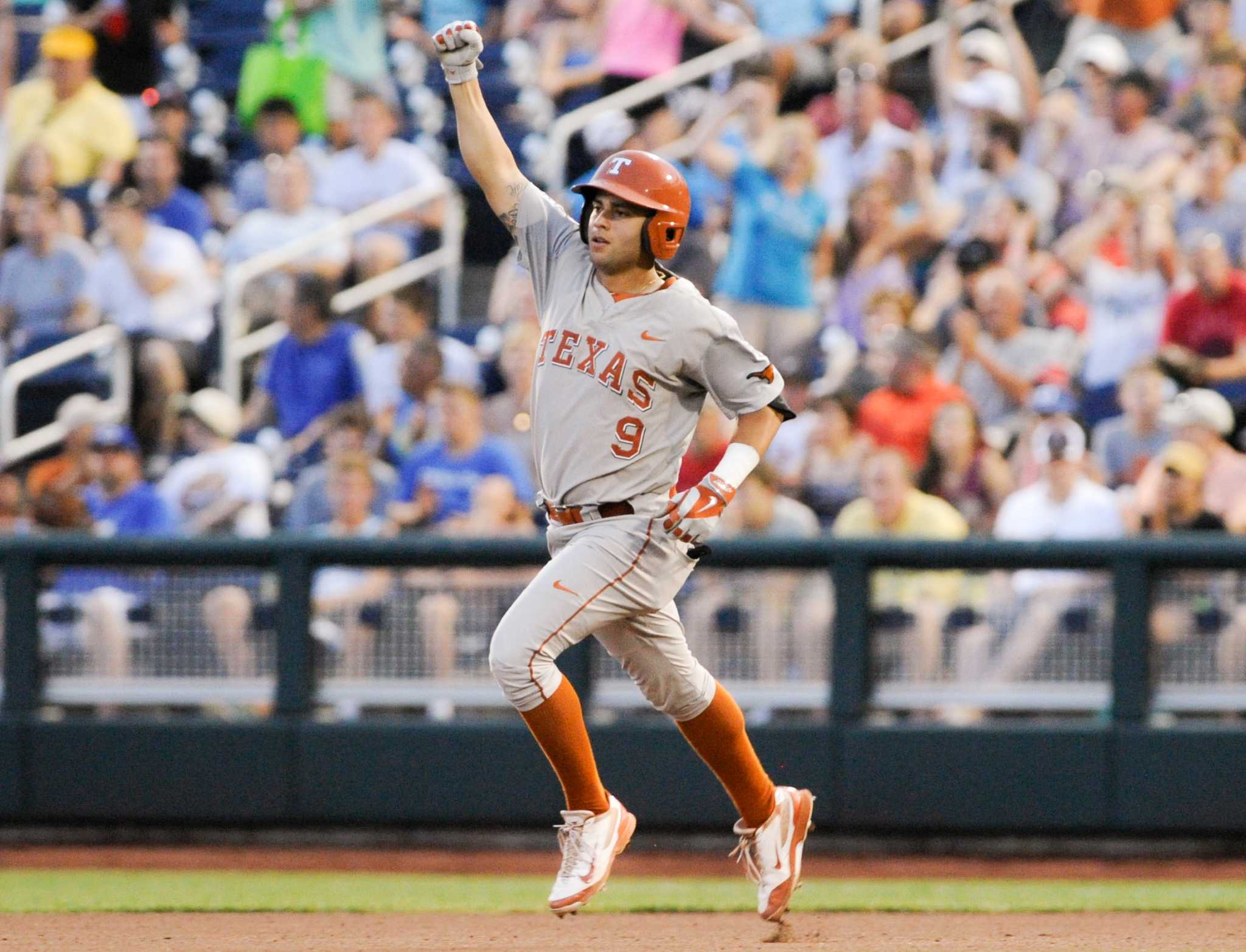 Texas staves off elimination with long ball, stellar pitching