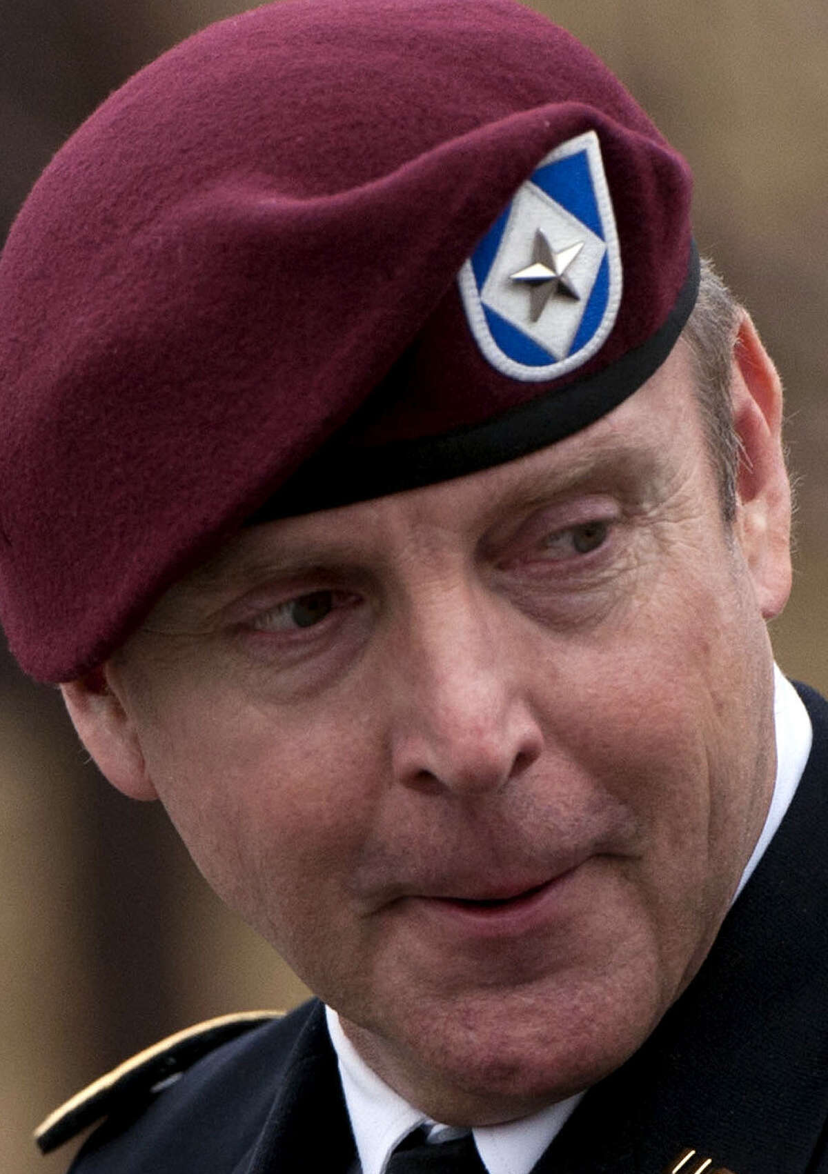 General in sex case to retire with 2-rank demotion