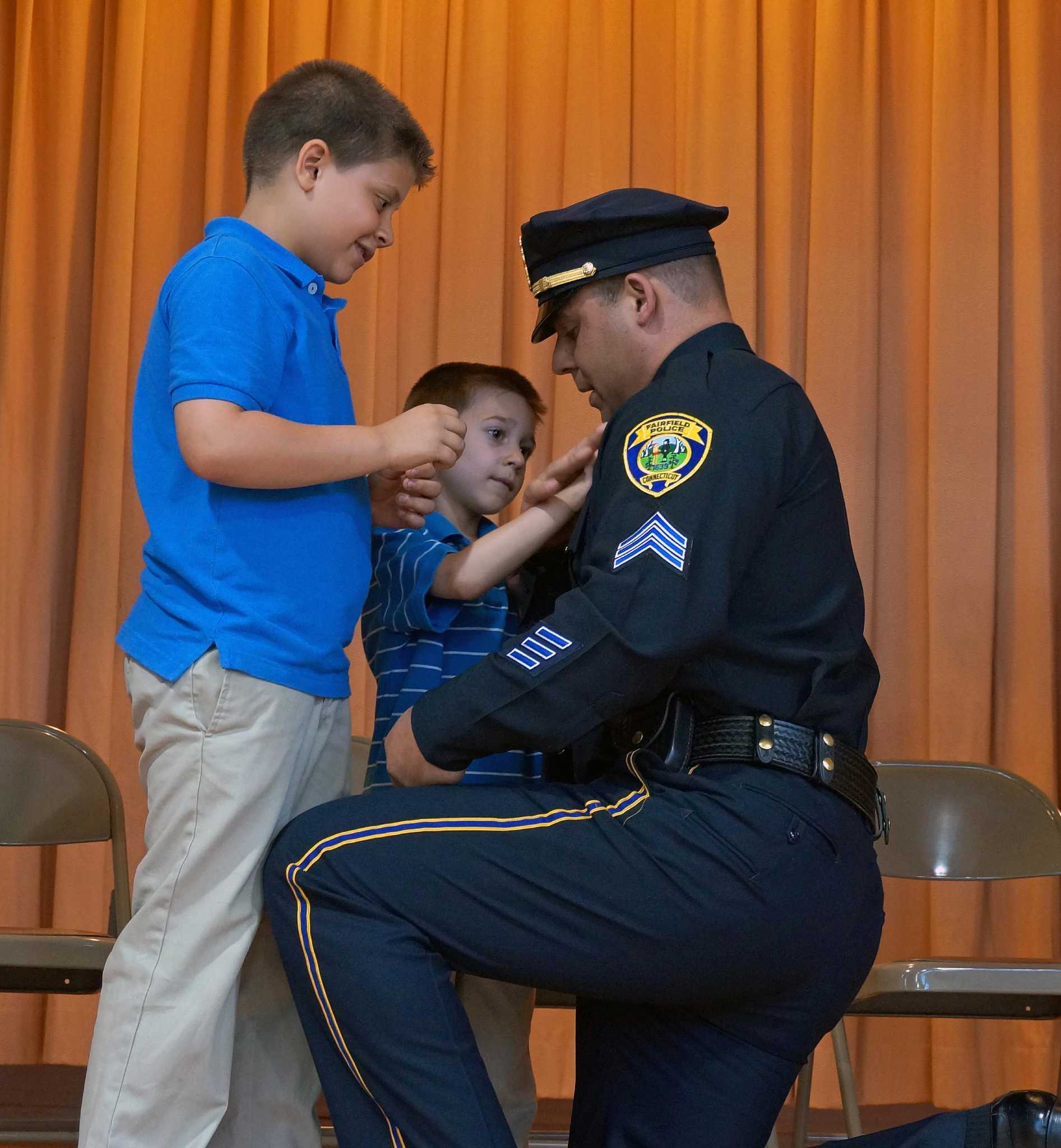 Four police officers saluted at promotions ceremony