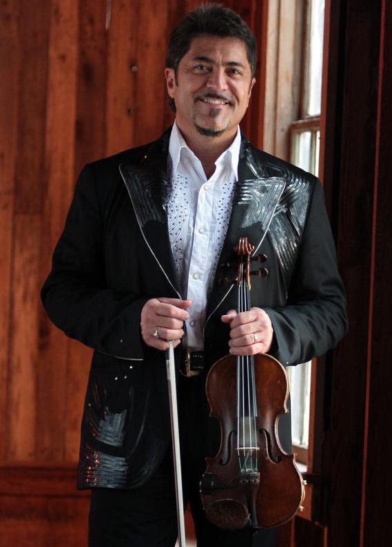 Triple fiddles keep Flores happy