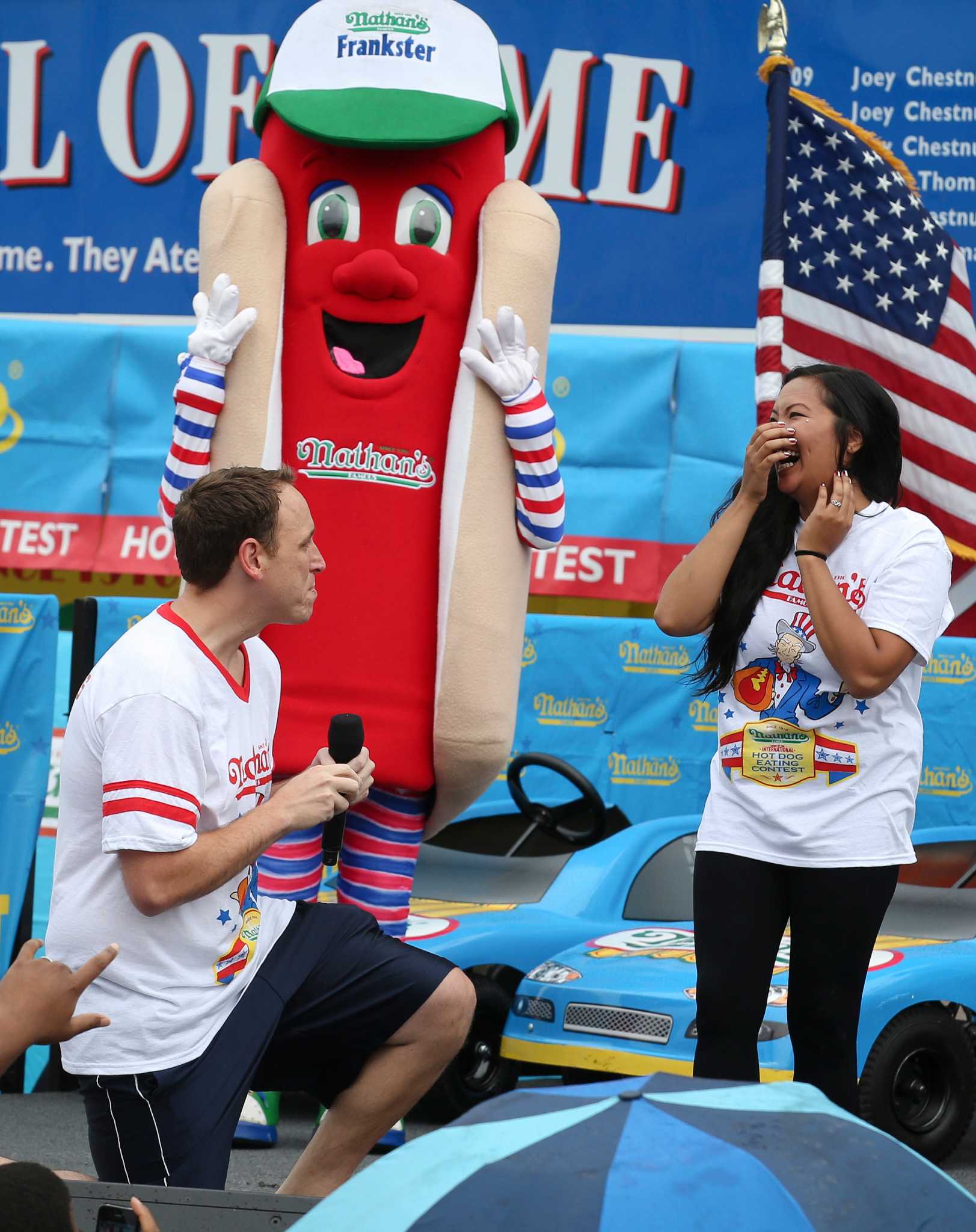 Joey Chestnut gets mustard yellow belt and fiancee