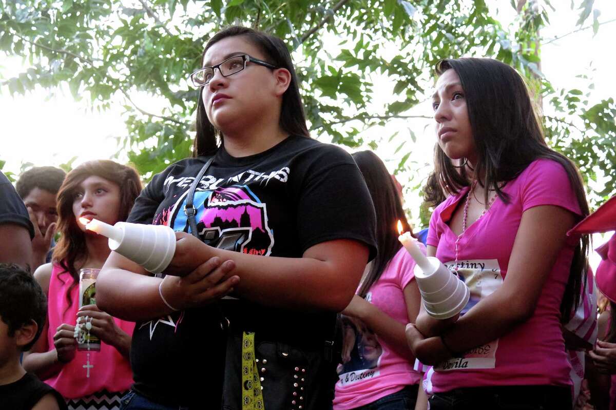Family killed in double-murder suicide remembered at vigil