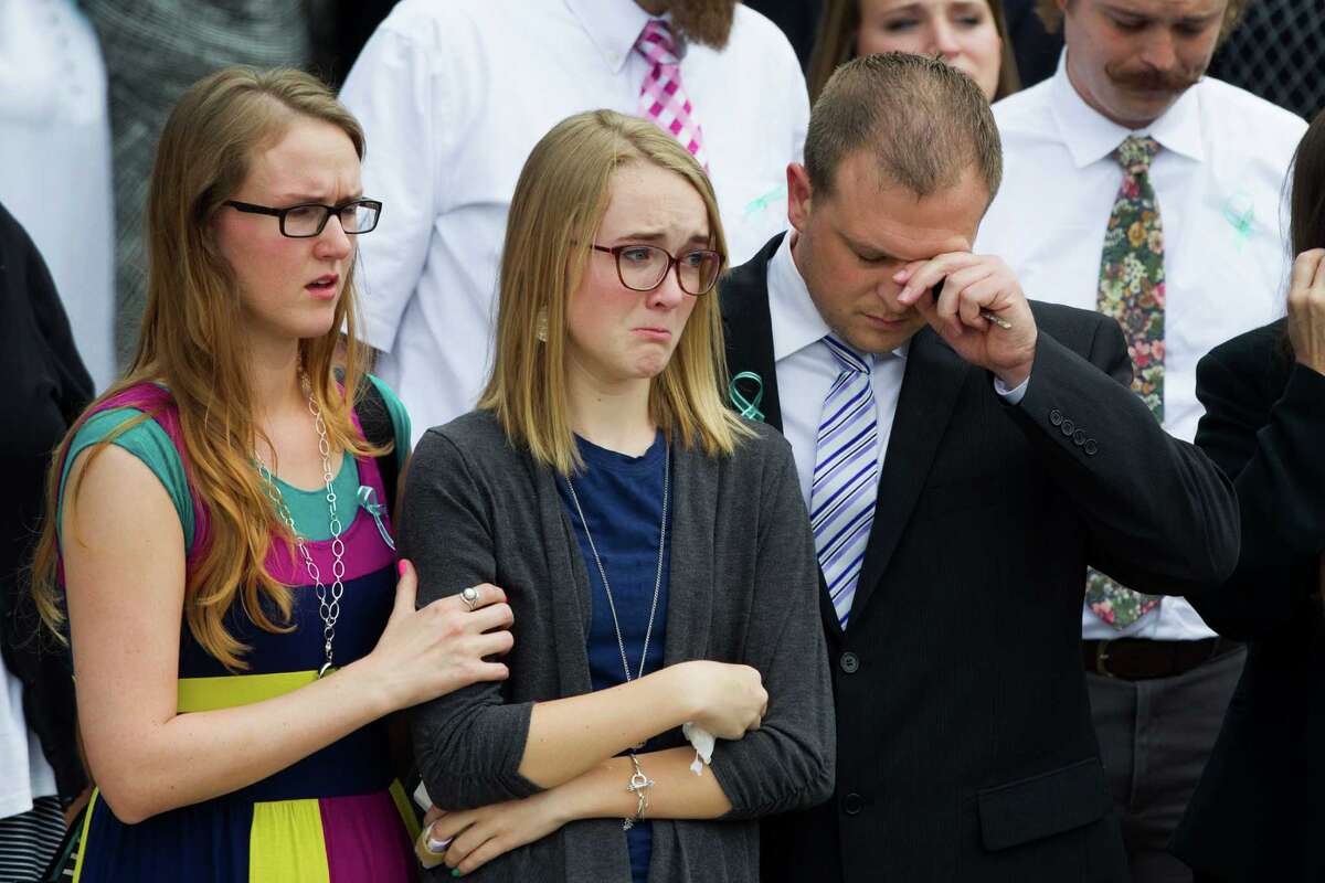 Hundreds mourn Spring shooting victims at funeral