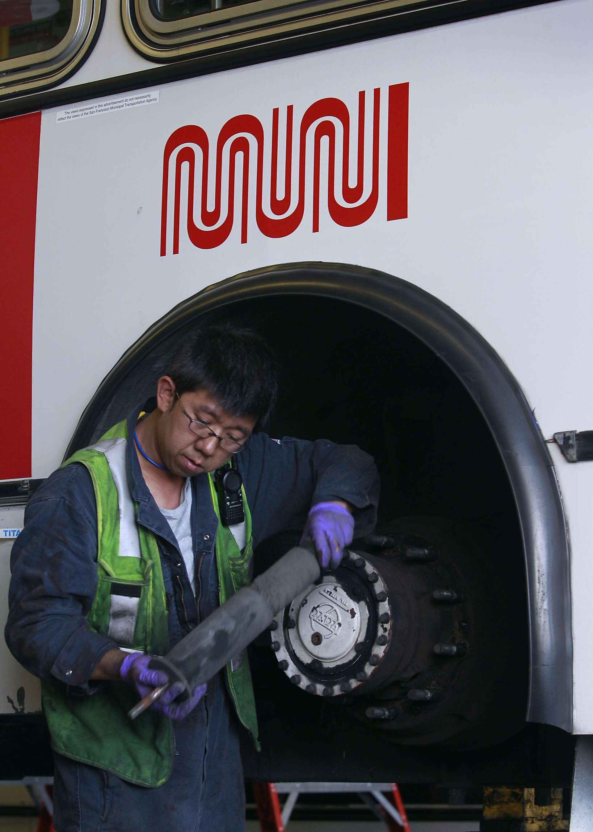 Muni mechanic makes the wheels on the bus go round