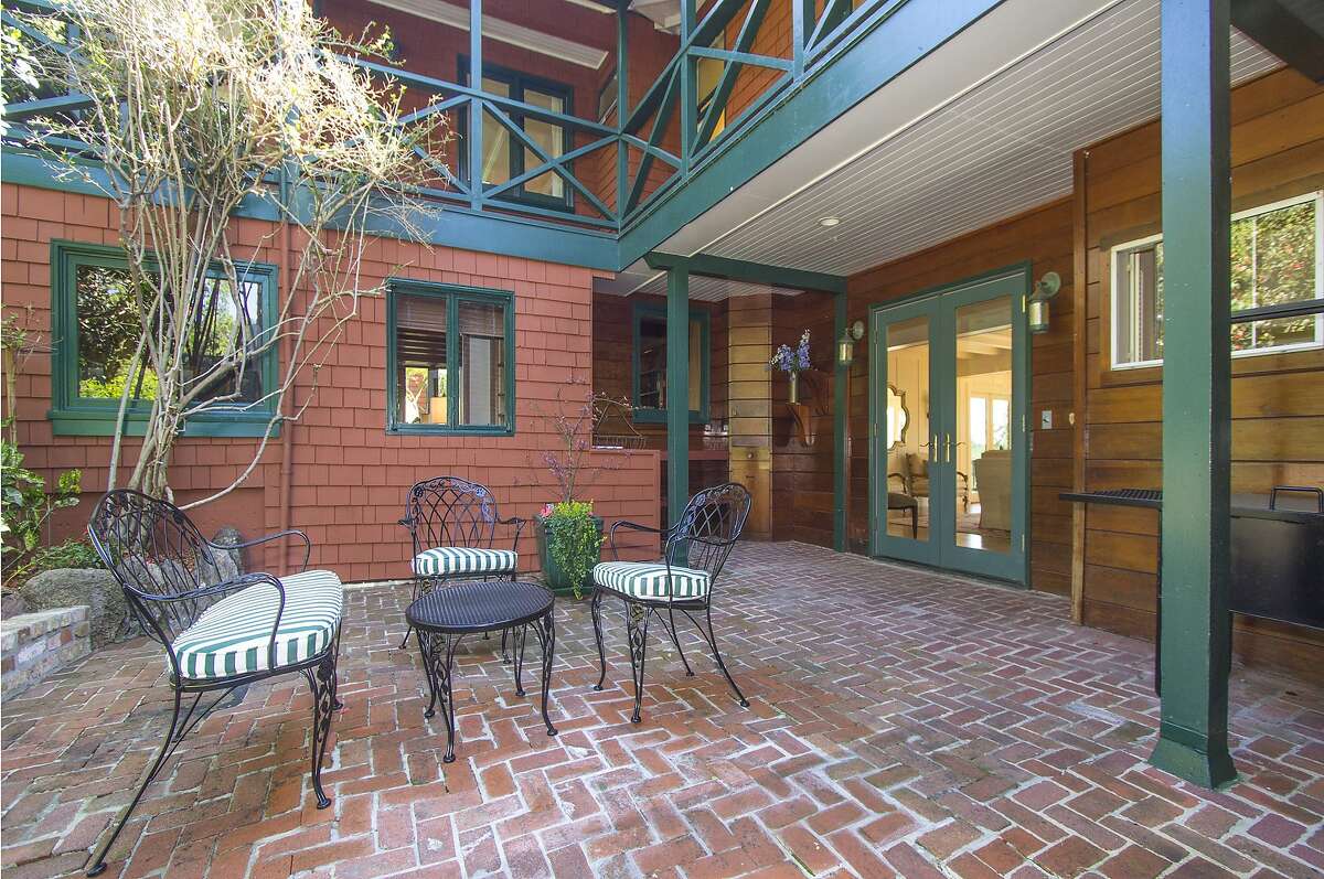 Former hunting lodge boasts multiple patios, classic design