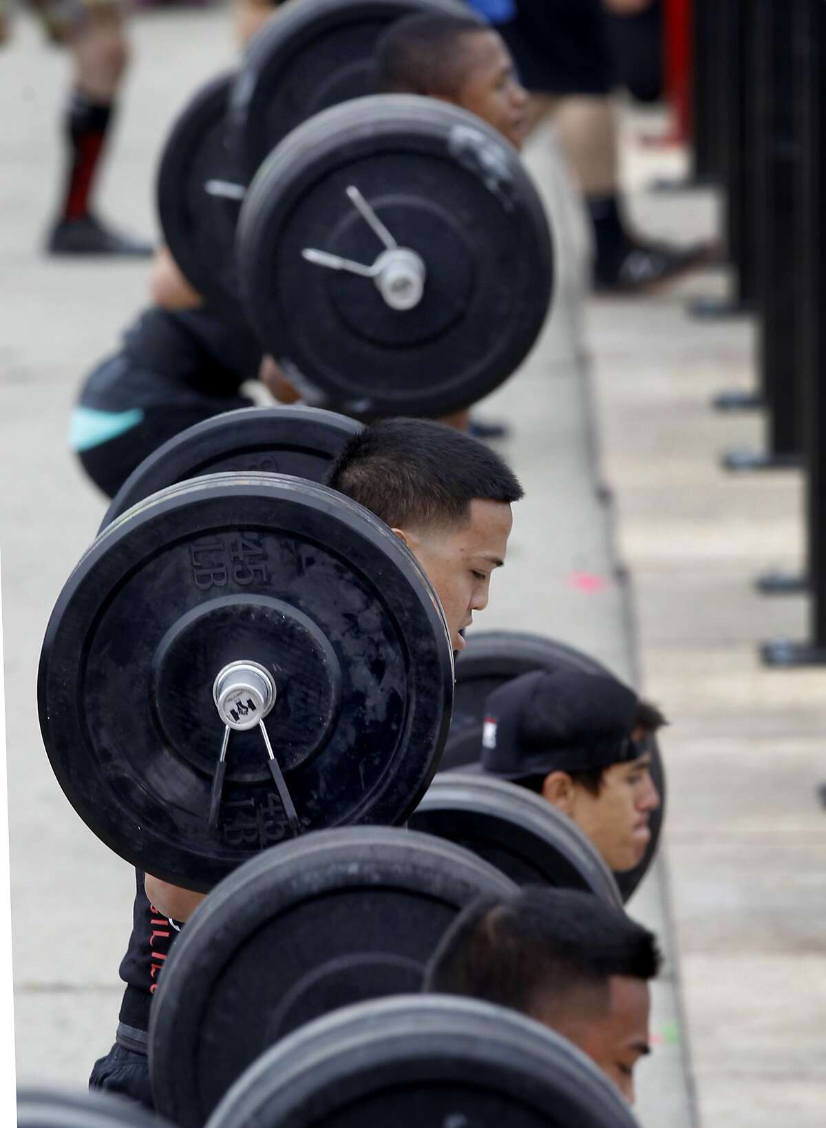 Hundreds sweat and strain at CrossFit contests on Treasure Island